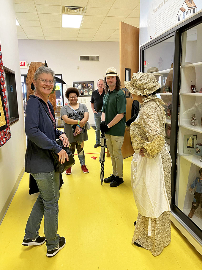 Follow the yellow floor road! These visitors are off to see the wizard... of Hollywood memorabilia.