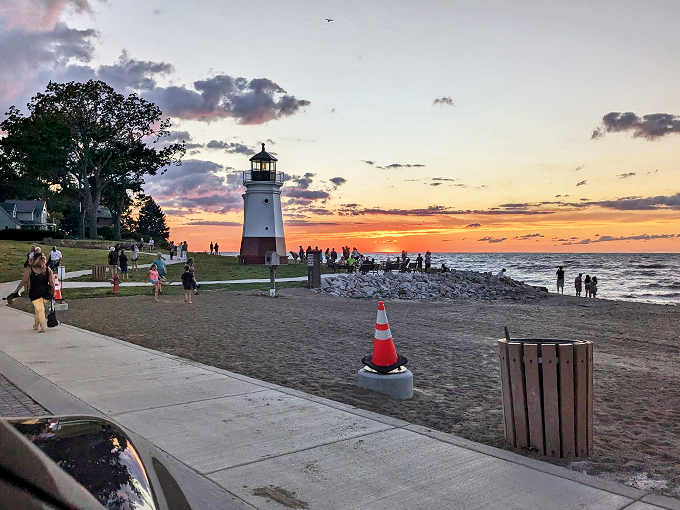 "Sunset seekers unite! This lighthouse draws crowds like a sale at Macy's, proving that Mother Nature's light show never goes out of style."