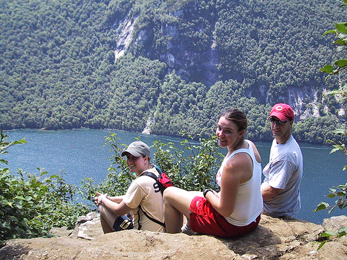 Three's company on this rocky perch. Looks like they've found the best seats in nature's amphitheater!
