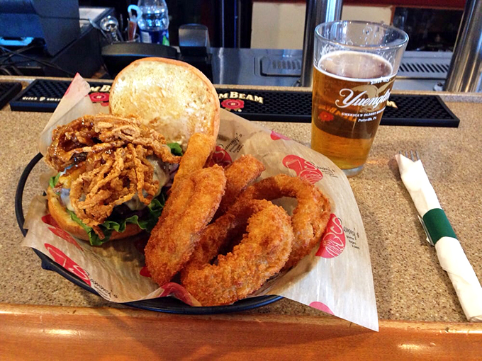 Behold, the dynamic duo of comfort food! This burger and beer pairing is like Batman and Robin, if they were delicious and came with fries.
