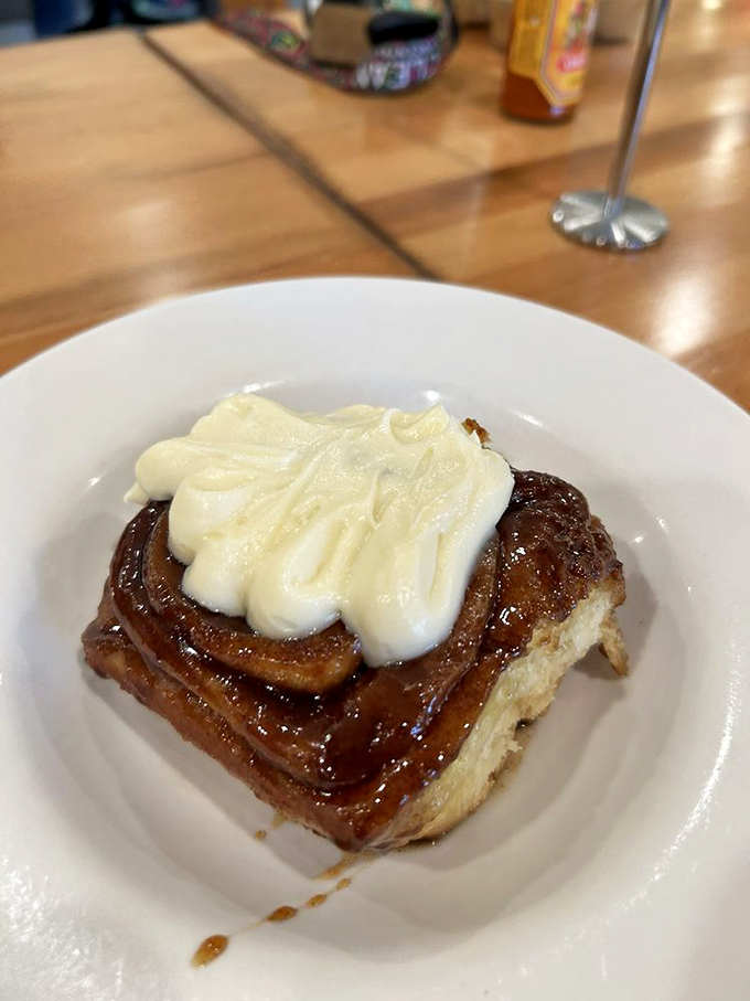 Behold, the cinnamon roll's final form! Topped with a cloud of cream, it's practically begging to be your new breakfast bestie.