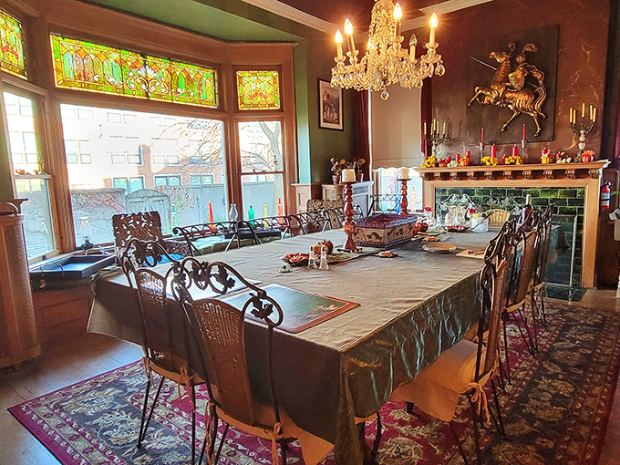 Feast your eyes on this grand dining room! With stained glass and chandeliers, it's the perfect spot for your next jousting tournament... or family dinner.