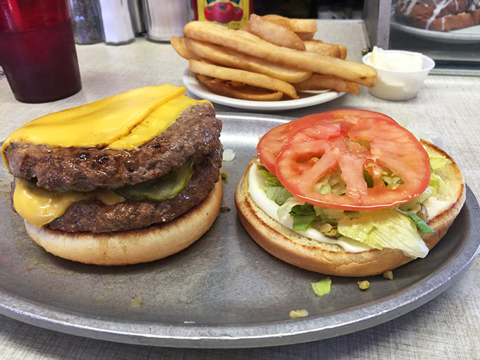 Holy moly, that's a burger! Two patties, melty cheese, and all the fixings – it's the Colosseum of comfort food, and you're the conquering hero.
