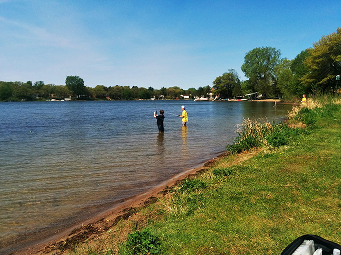 Fishing or standing in water? Either way, these folks have mastered the art of looking busy while doing nothing.