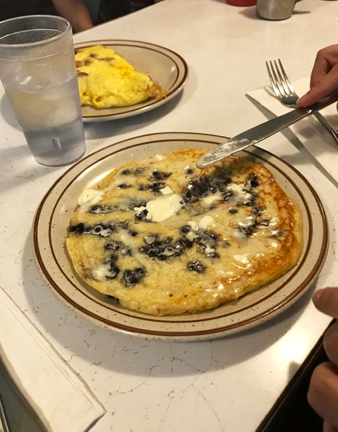 Butter melting on a golden pancake canvas – it's breakfast's answer to a Monet masterpiece.