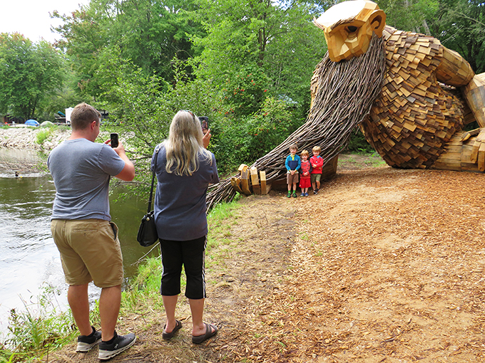 Size matters when it comes to selfies! Visitors strike a pose with Benny, proving sometimes the best fishing stories are made on dry land.