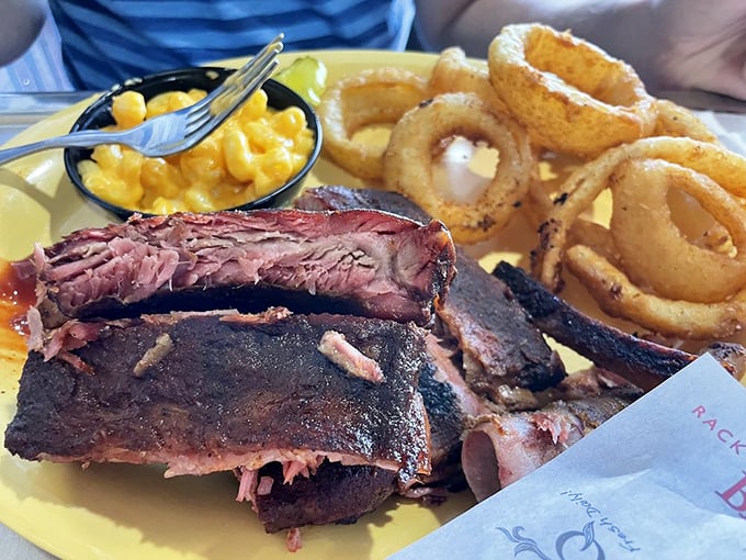 Ribs that'll make you weak in the knees. Paired with mac and cheese and onion rings, it's a plate of pure comfort.