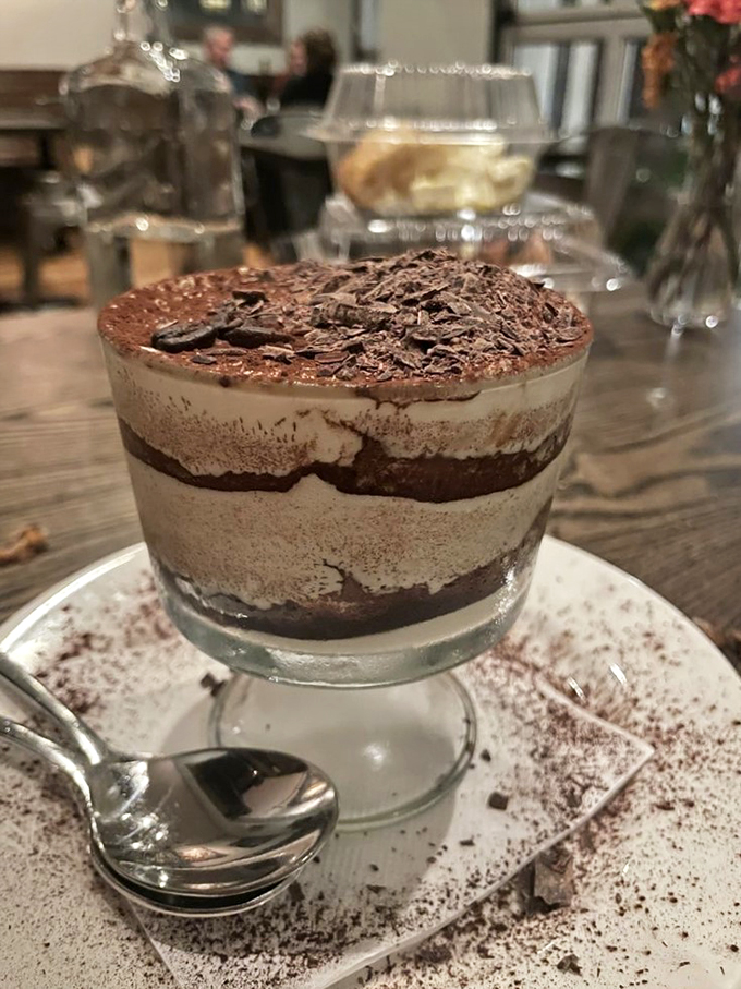 Tiramisu that's ready for its close-up! Layers of creamy decadence topped with a chocolate confetti party. It's like a hug for your taste buds.