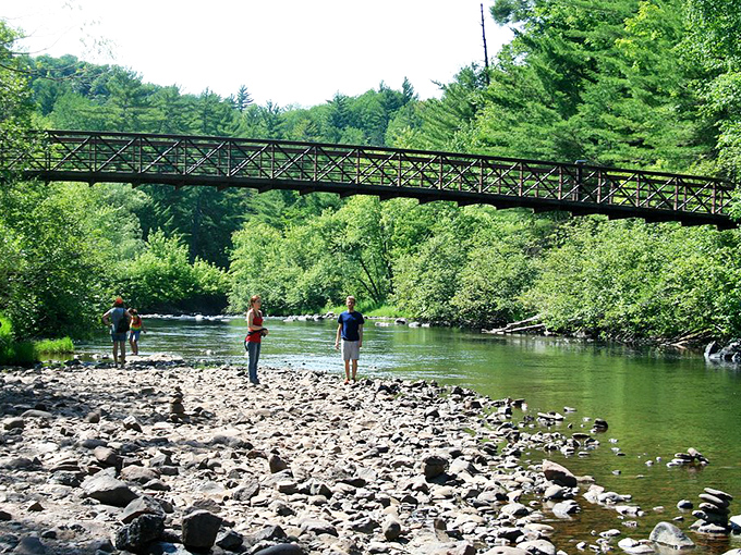 River crossing or impromptu geology lesson? Either way, these folks are getting their daily dose of vitamin Nature.