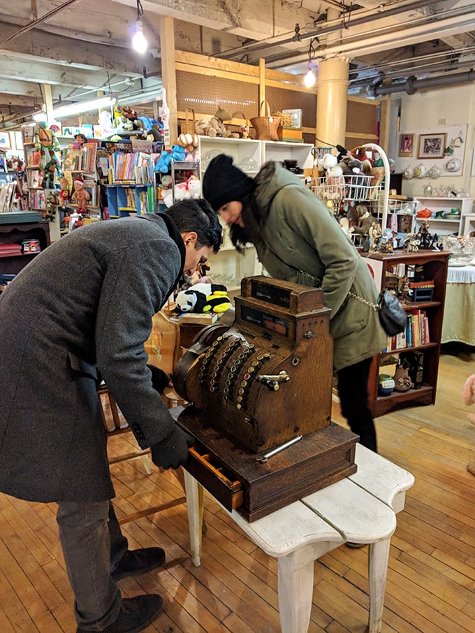 Treasure hunters at work! These modern-day Indiana Joneses are excavating history, one vintage cash register at a time.