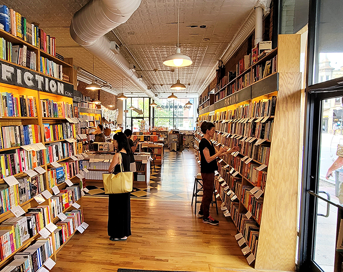 Book lovers in their natural habitat. Watch as they navigate the shelves with the grace of seasoned explorers.