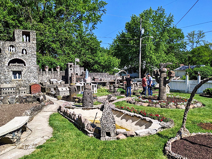 "Honey, can we move here?" Visitors marvel at the rock garden's miniature wonders, proving good things really do come in small packages.