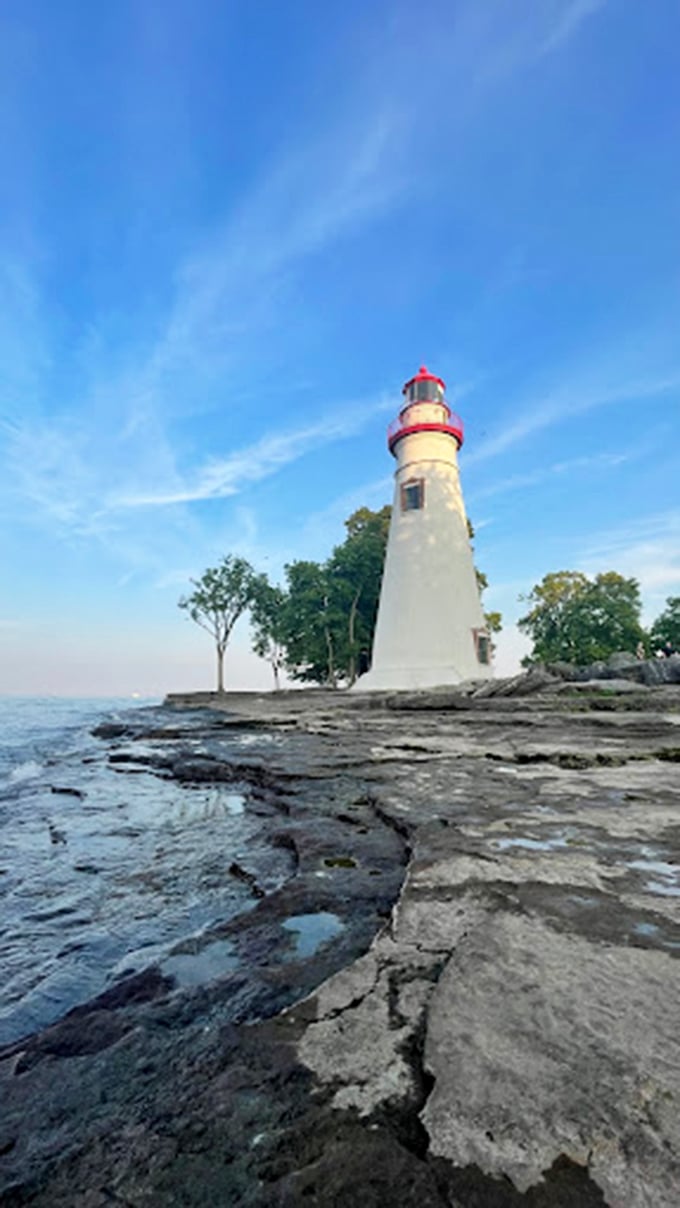 Ahoy, landlubbers! This picturesque lighthouse is serving up views so good, you'll swear you can see your house from here (spoiler: you can't).