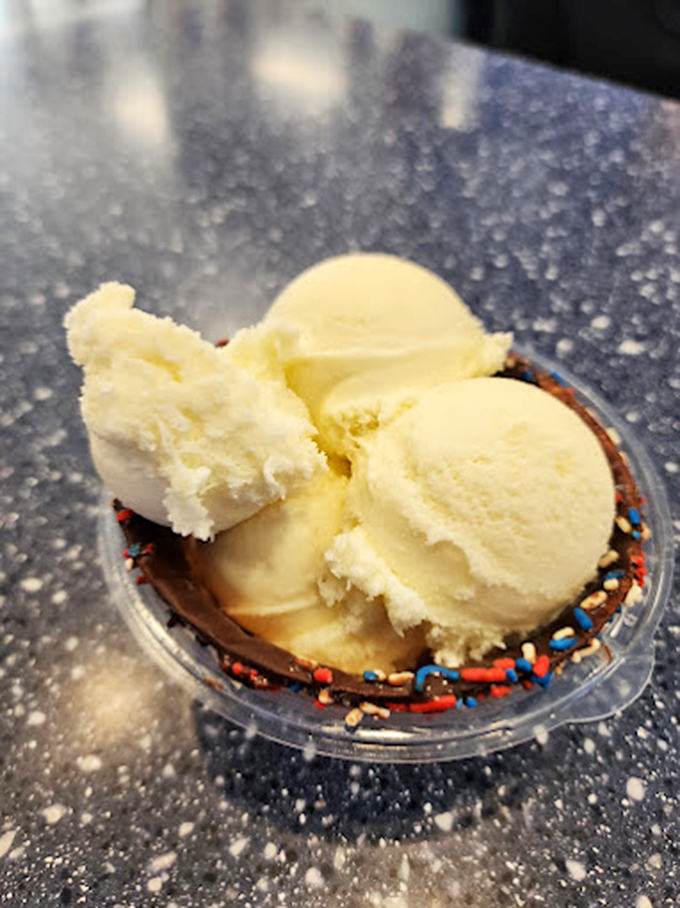 Sprinkles make everything better! This sunny scoop of banana cream pie ice cream is wearing confetti like it's ready for a taste bud party.