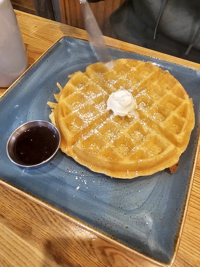 Waffle perfection achieved! This golden disc of deliciousness is crying out for a river of syrup and a dollop of butter.