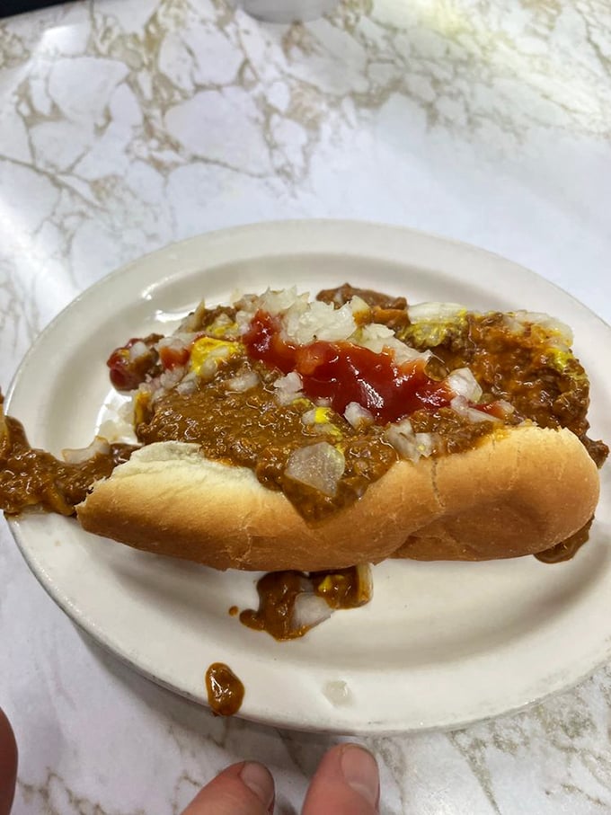 Chili cascading over a hot dog like Niagara Falls of flavor. Warning: May induce spontaneous happiness.