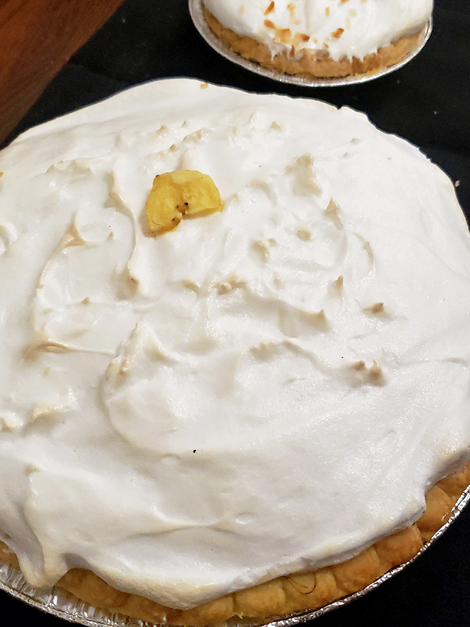 Clouds of meringue floating atop a sea of creamy filling. This pie isn't just dessert; it's a meteorological phenomenon on a plate!