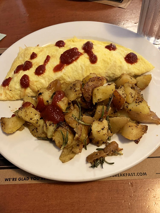 Omelette nirvana! This yellow beauty, paired with crispy home fries, is like sunshine on a plate. Grab your shades!