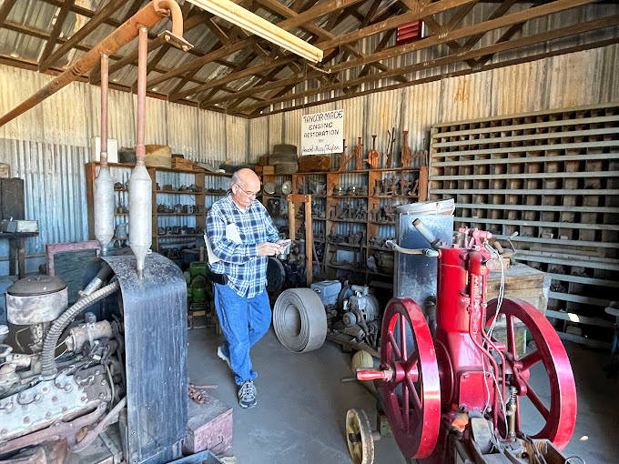 History's handyman at work! This dedicated curator ensures every rusty bolt has a story to tell in this mechanical menagerie.