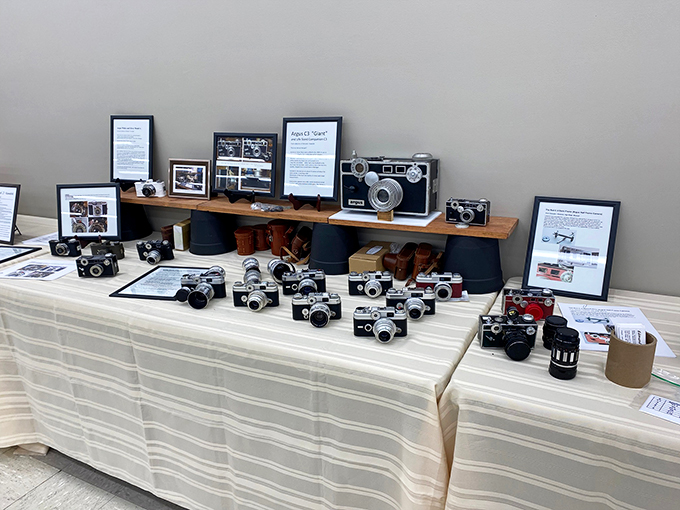 Table full of timeless treasures! From leather cases to shiny lenses, it's a buffet of bygone technology that'll make your smartphone feel young again.