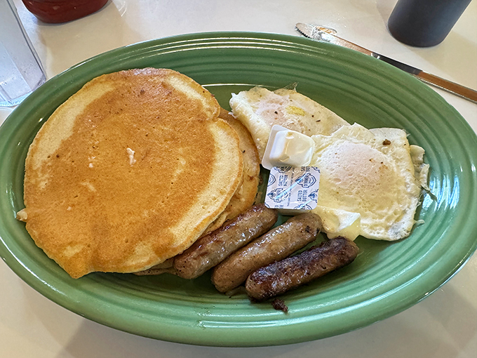 Pancakes so fluffy they might float away, eggs sunny enough to brighten your mood, and sausages that could make a vegetarian reconsider. This is breakfast nirvana, folks.
