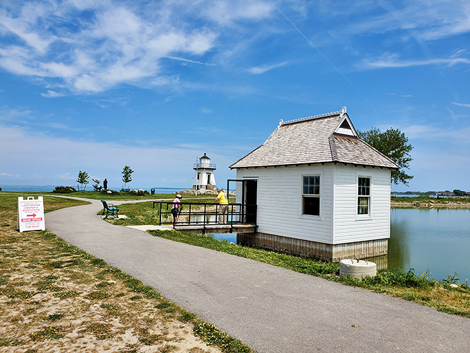 A lighthouse with a plus-one! This dynamic duo of structures is like the Batman and Robin of Lake Erie's shoreline.