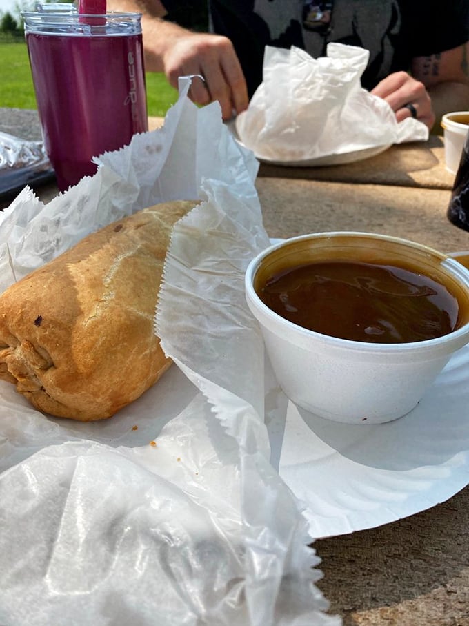 Gravy: nature's makeup for food! This pasty's ready for its close-up, with a side of liquid gold.