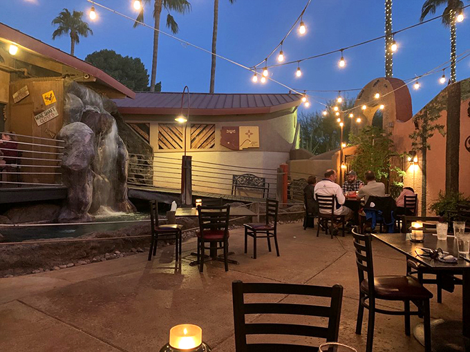 Outdoor dining with a side of waterfall? Yes, please! It's like a desert oasis, minus the mirages and plus the margaritas.