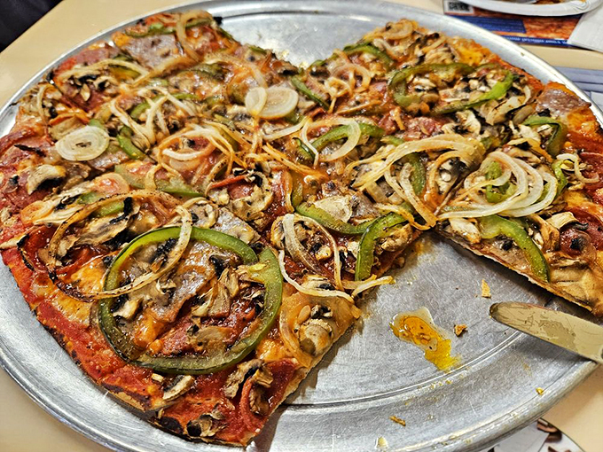 Thin crust perfection! This pizza is so loaded, it's doing more heavy lifting than my gym membership.