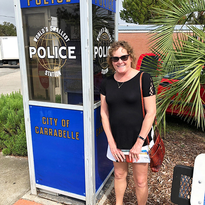 Smile, you're on Candid Camera! Or just posing with the world's most photogenic phone booth turned police station.