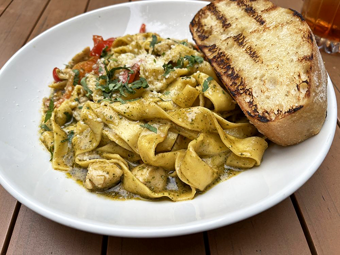 Pesto pasta that would make an Italian nonna weep with joy. It's a plate of green goodness that even Popeye would trade his spinach for.