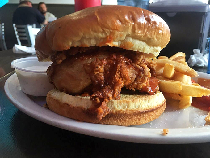 Behold, the crown jewel of Skoog's menu! This chicken sandwich is so good, it might just solve world peace... or at least your hunger pangs.