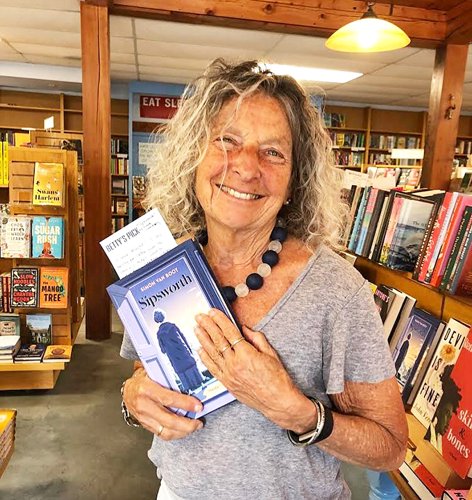 Books and smiles &ndash; a perfect combination! This happy customer embodies the joy of finding that just-right read. It's better than striking gold... it's striking words!