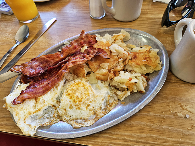 Rise and shine, sleepyhead! This classic breakfast plate is like a warm hug from your grandma, if your grandma was a short-order cook extraordinaire.