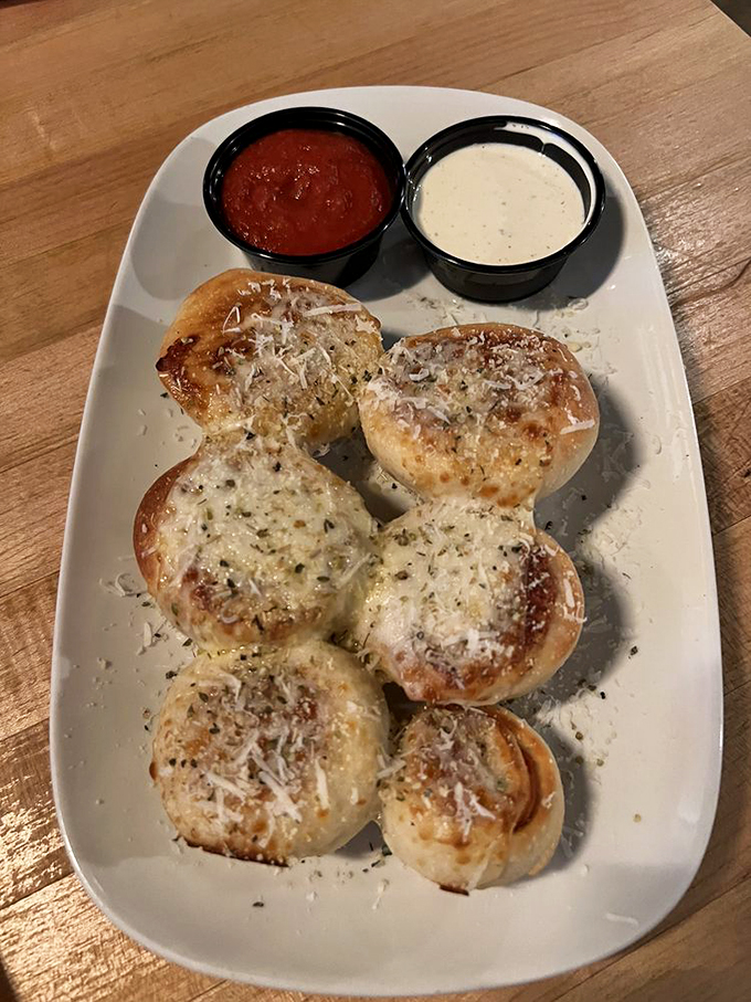 Pepperoni pinwheels: the pizza's sassy little cousin. These swirly delights are like edible fidget spinners for your taste buds, paired with dipping sauces for extra flavor fun.