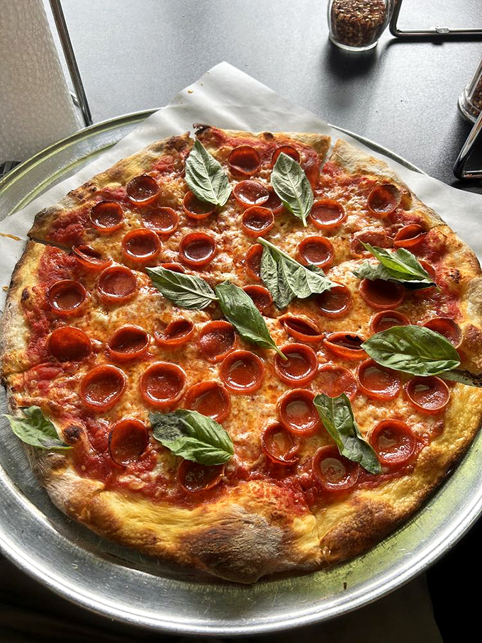 Pizza perfection, achieved! This pepperoni pie, dotted with crispy cups of savory goodness, is giving us serious "Lady and the Tramp" vibes &ndash; minus the shared noodle.