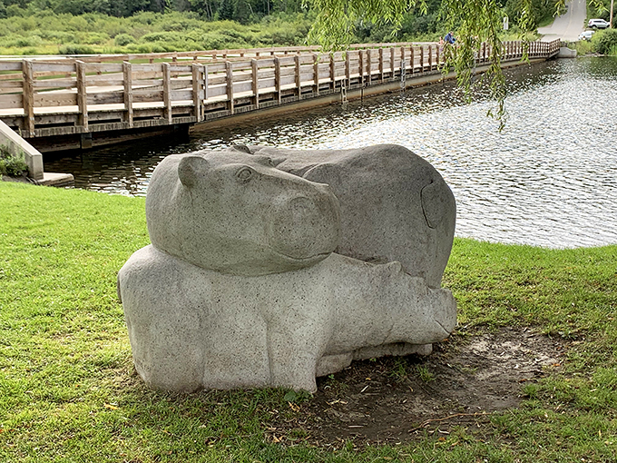 A whimsical hippo sculpture keeps watch over the bridge, proving that even engineering marvels need a mascot.