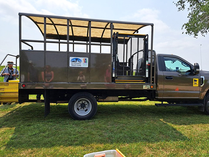 All aboard the Bison Express! This tour bus is like a safari vehicle, minus the lions and plus a whole lot of American history.