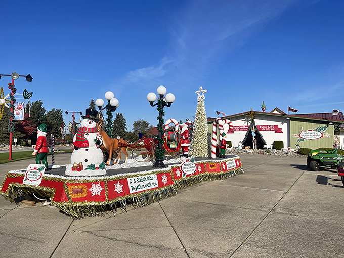 Your holiday spirit will shine bright when you see this festive parade float featuring a cheerful snowman and Santa Claus.