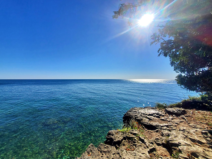 Roadside attraction or natural wonder? At Cave Point, you can dip your toes in both &ndash; literally!