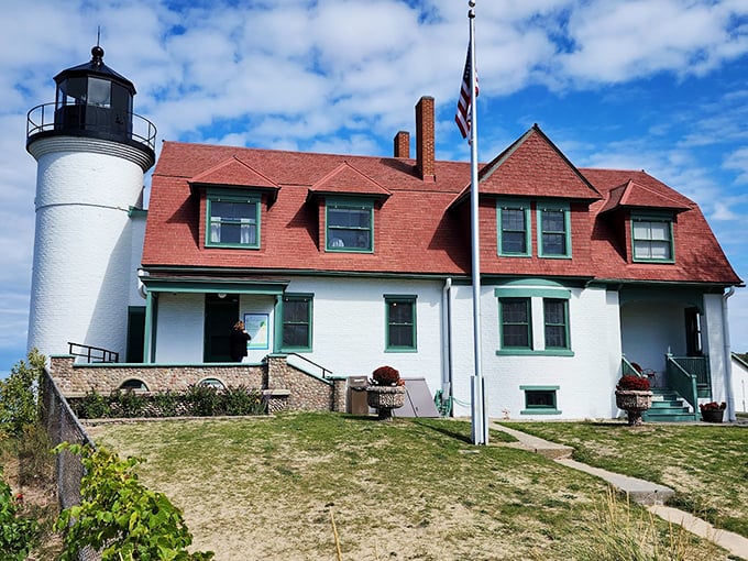 Postcard come to life! With its pristine tower and red-roofed charm, Point Betsie is ready for its close-up, Mr. DeMille.