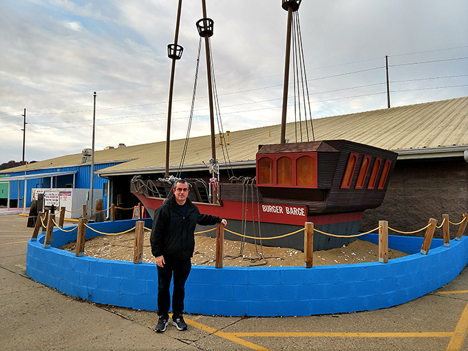 Riverside feast: Where mammoth burgers meet nautical charm in a perfect storm of deliciousness.