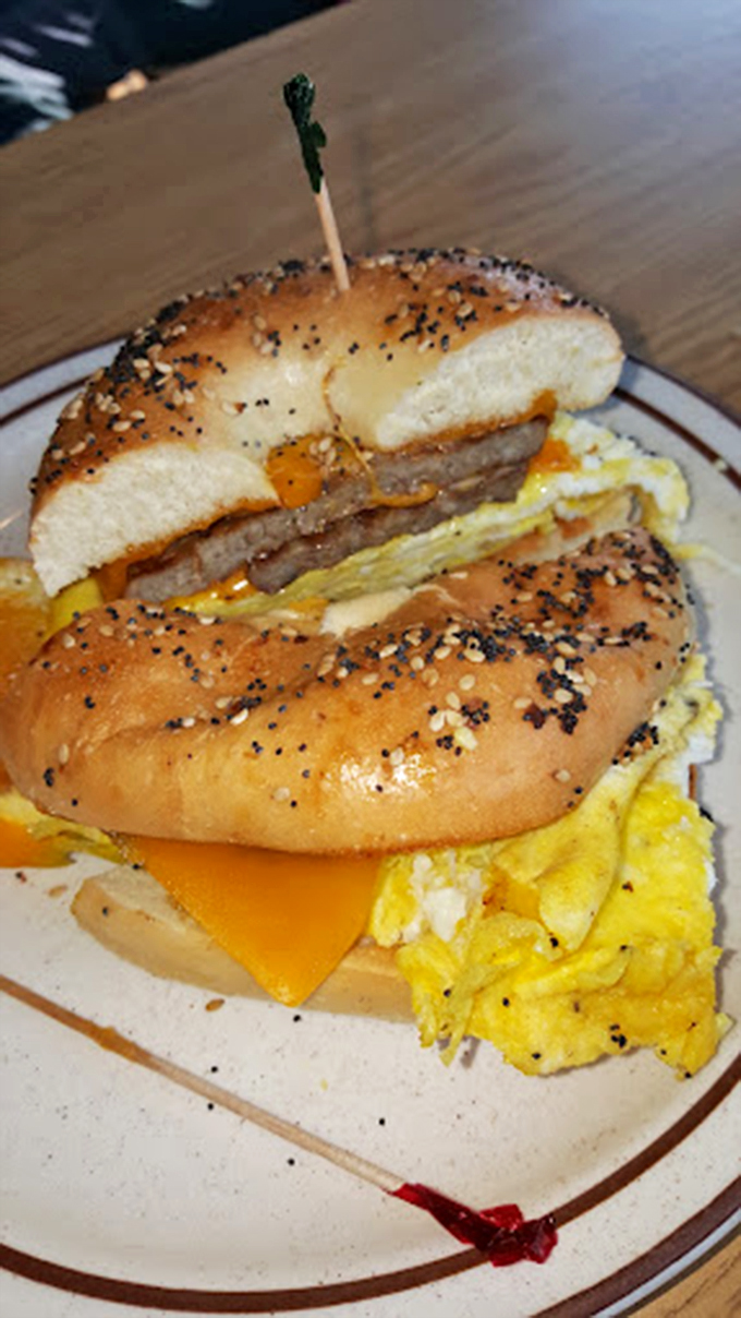 This bagel sandwich is stacked higher than a Jenga tower! It's a breakfast balancing act that's worth waking up for.