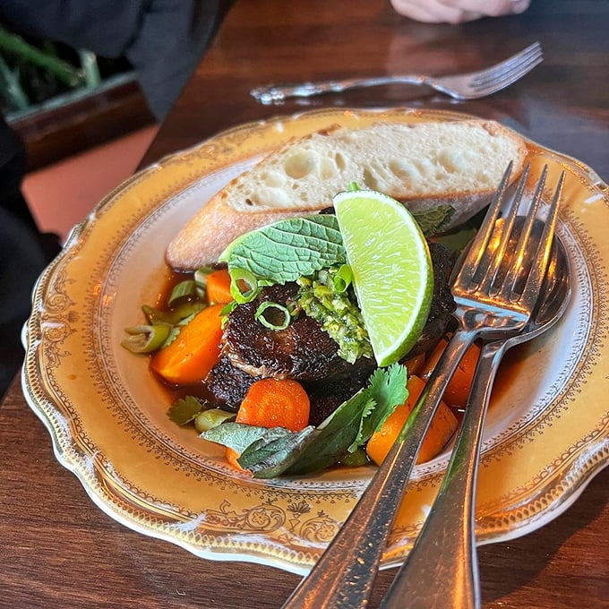 Beef short rib that's dressed to impress. This plate is like a fancy tuxedo for your taste buds, complete with veggie accessories.