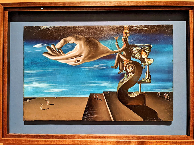 Talk about a helping hand! This Dalí-inspired art gives new meaning to the phrase "reach for the stars" - or in this case, the sunny Florida sky.