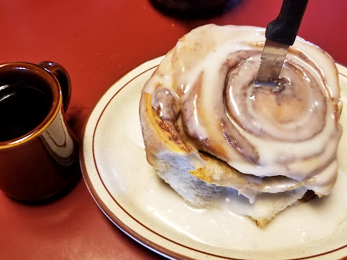 Coffee and cinnamon roll: a match made in heaven. It's like Romeo and Juliet, but with a much happier, tastier ending.