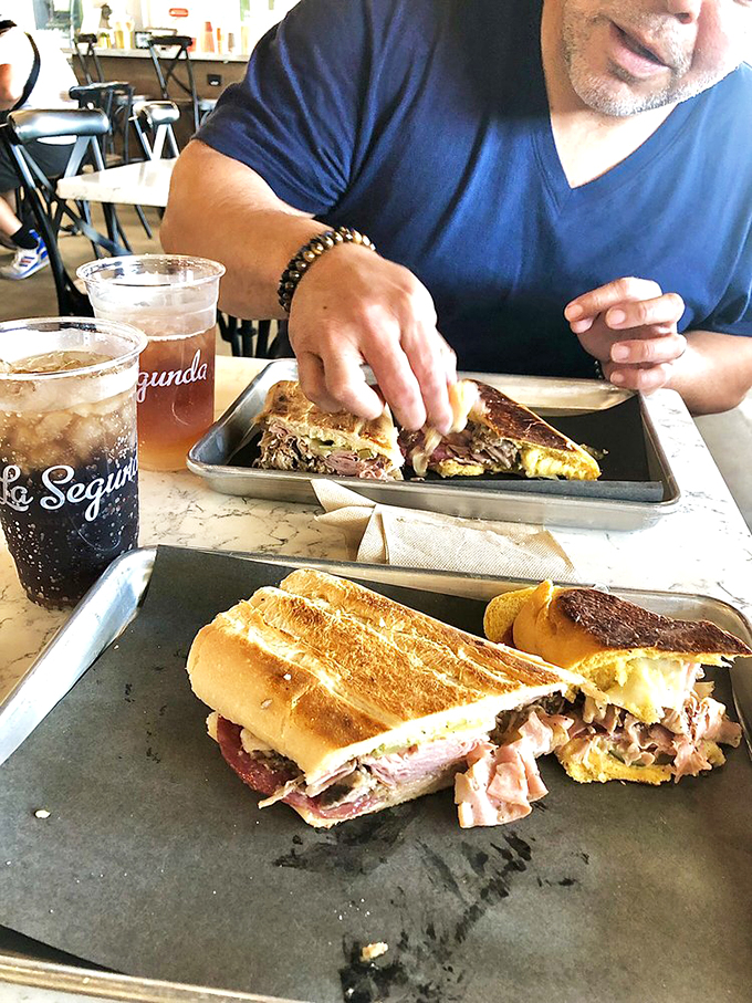 A tale of two sandwiches: The Cuban and Media Noche, locked in an eternal dance of deliciousness. It's like West Side Story, but with less singing and more mouth-watering goodness.