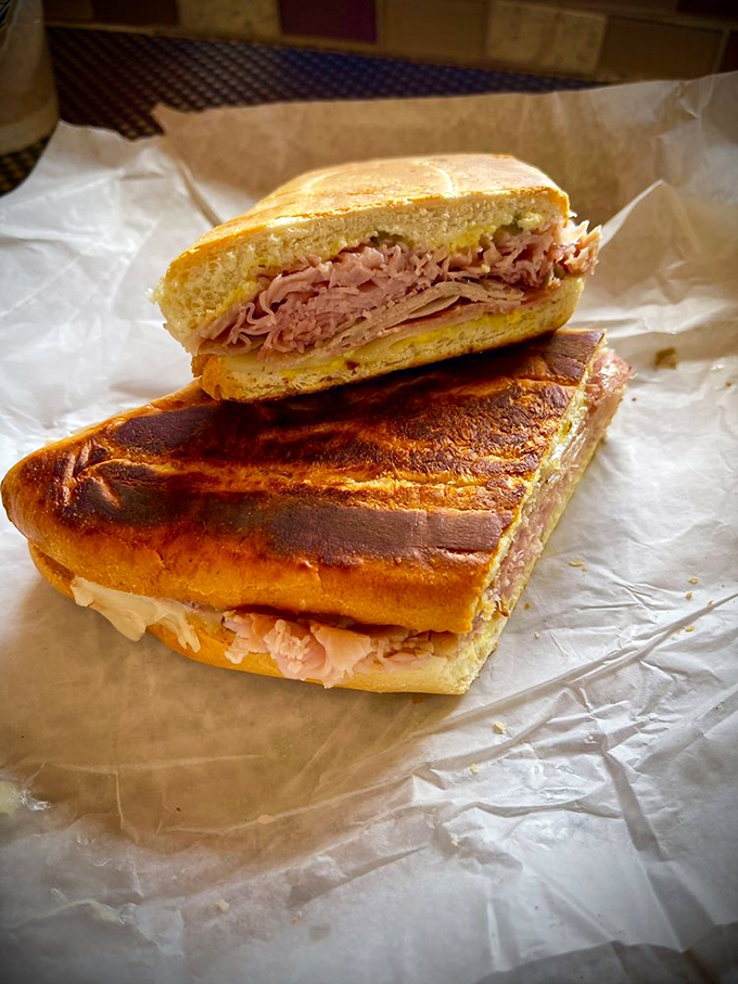 Behold, the Cuban sandwich in all its pressed perfection! It's not just lunch; it's a handheld flavor fiesta that'll transport you to Havana.
