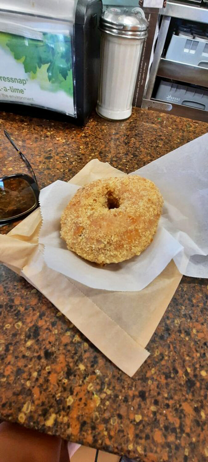 The crumb coat of champions! This donut looks like it took a delicious roll through a sandcastle. Beach day for your mouth!