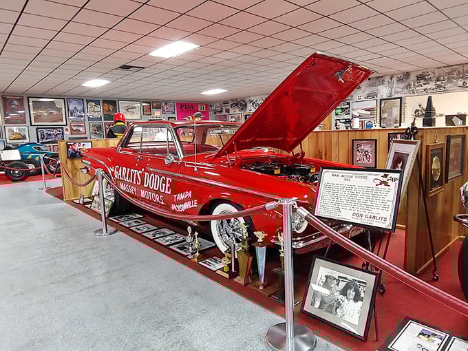 Cherry red and ready to rumble! This classic Dodge looks like it could tell tales that would make your grandfather blush and your lead foot itch.